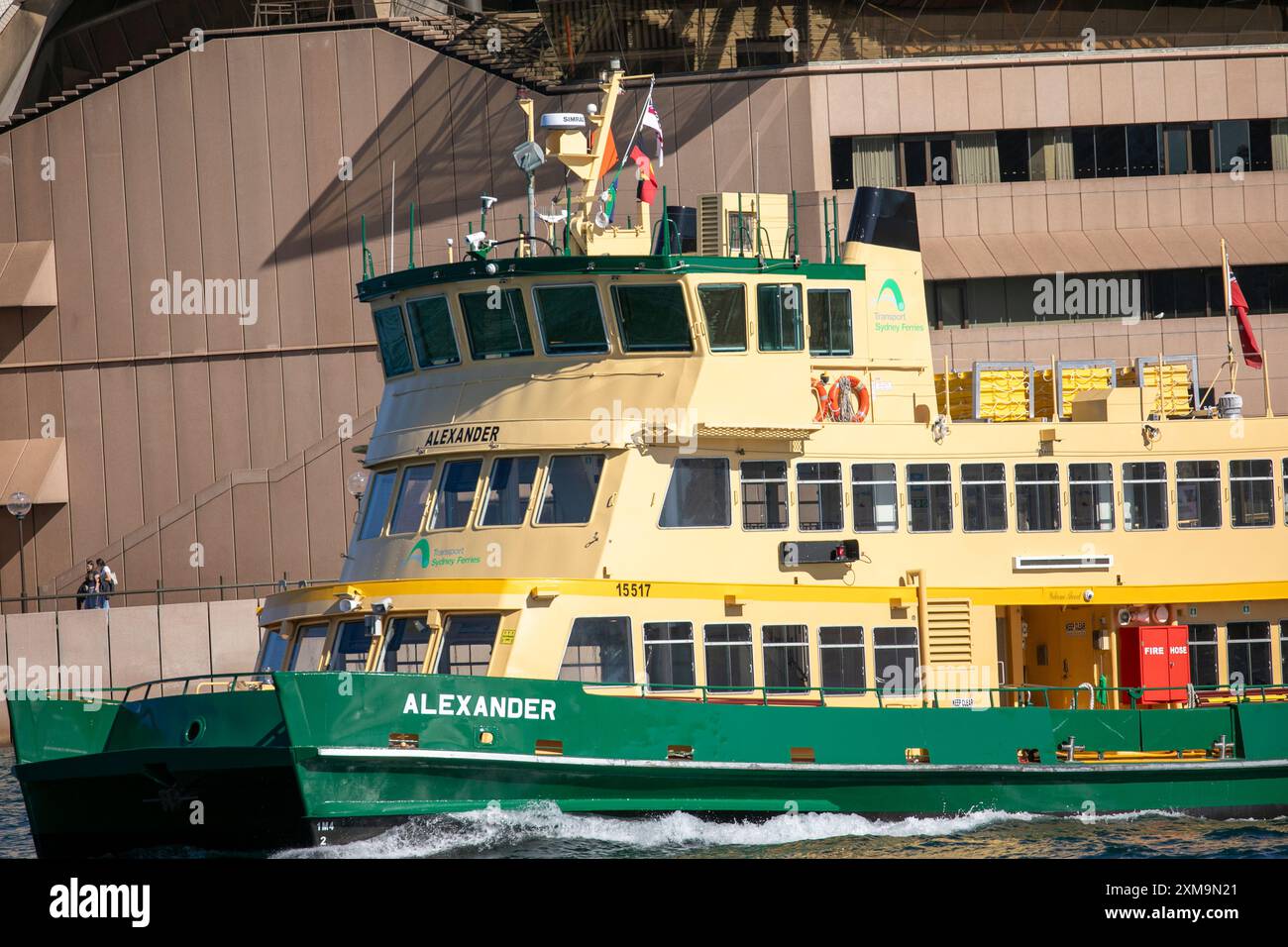 Close up of Sydney ferry Alexander passing the Sydney Opera House ...