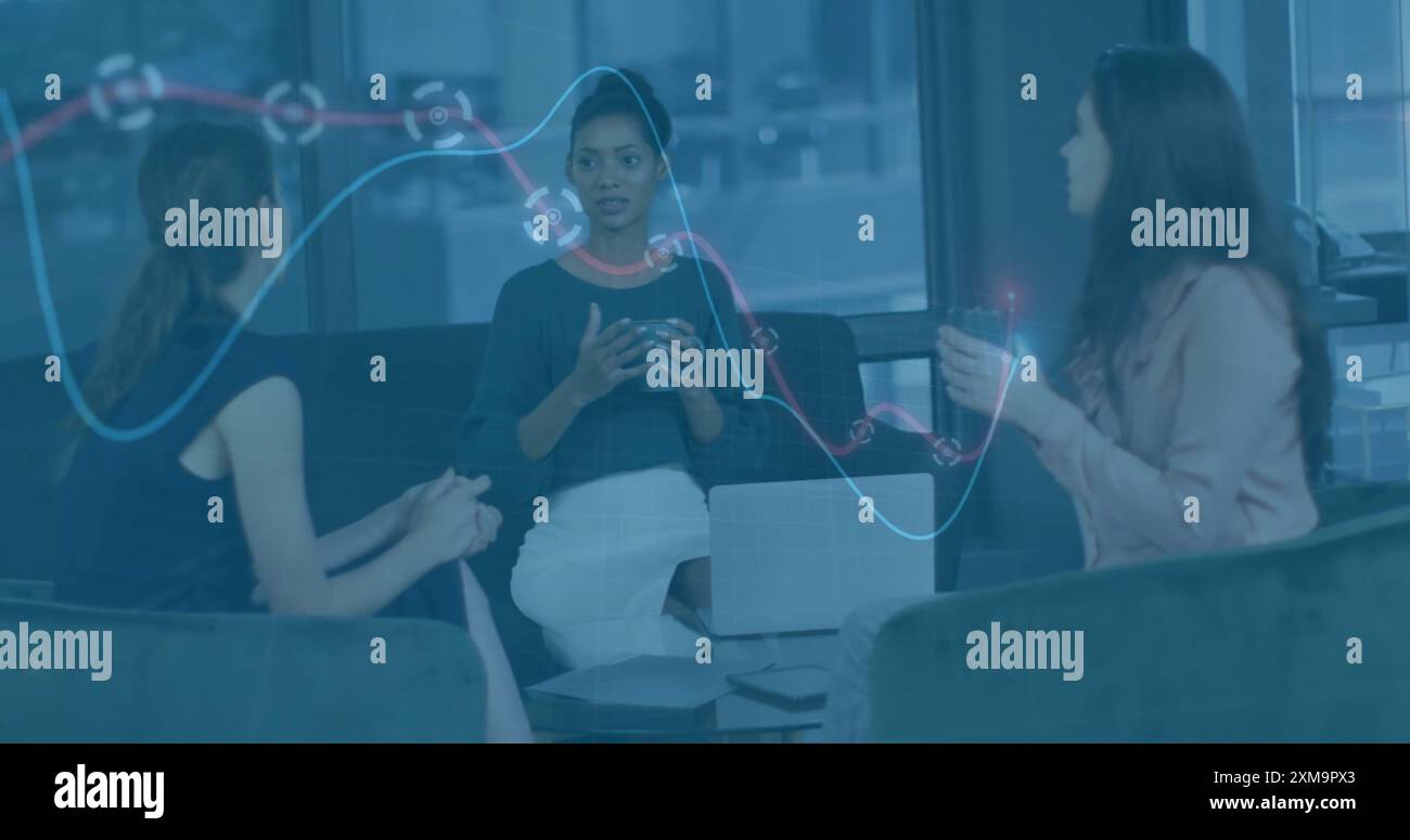 Businesswomen discussing strategy with data visualization image over ...