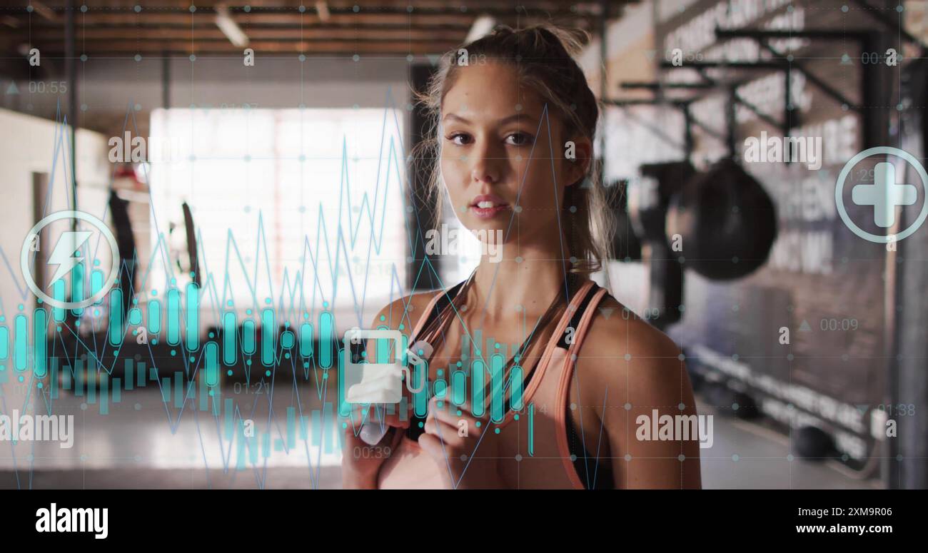 Fitness data and health monitoring image over woman in gym. exercise ...