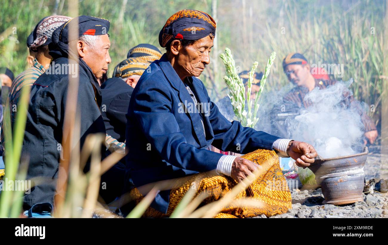 Javanese people pray during the Larungan ceremony on Mount Kelud Stock ...