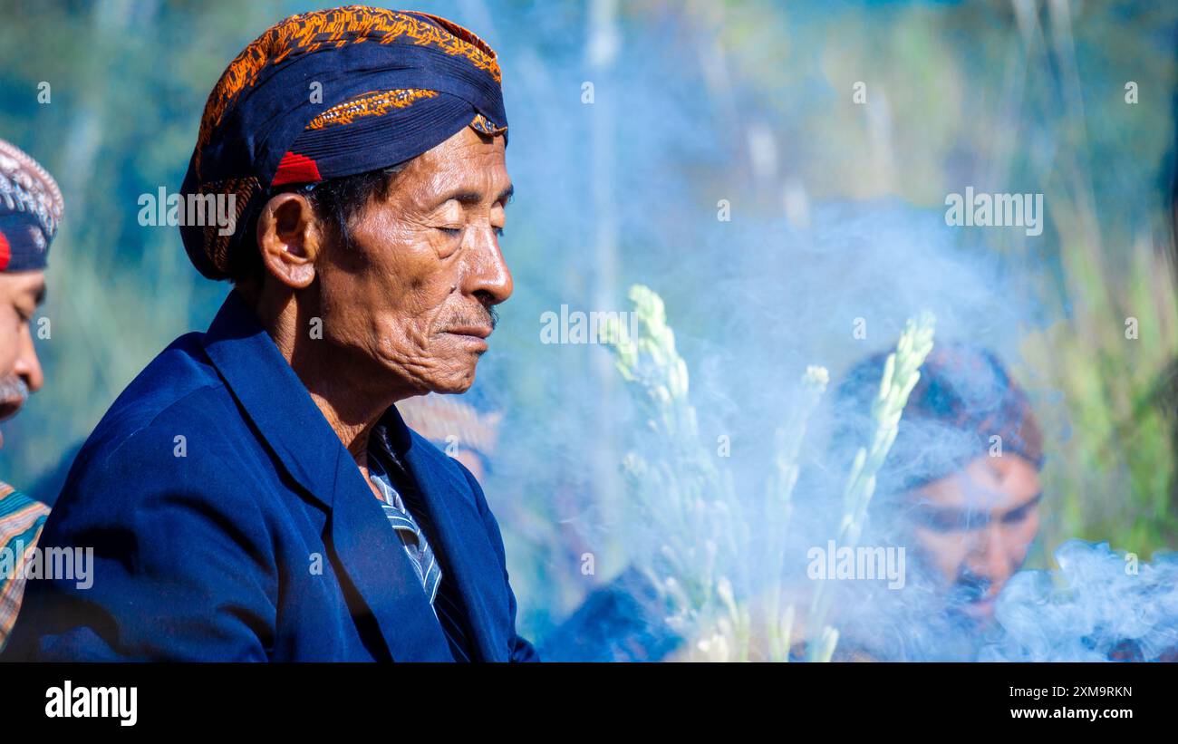 Javanese people pray during the Larungan ceremony on Mount Kelud Stock ...