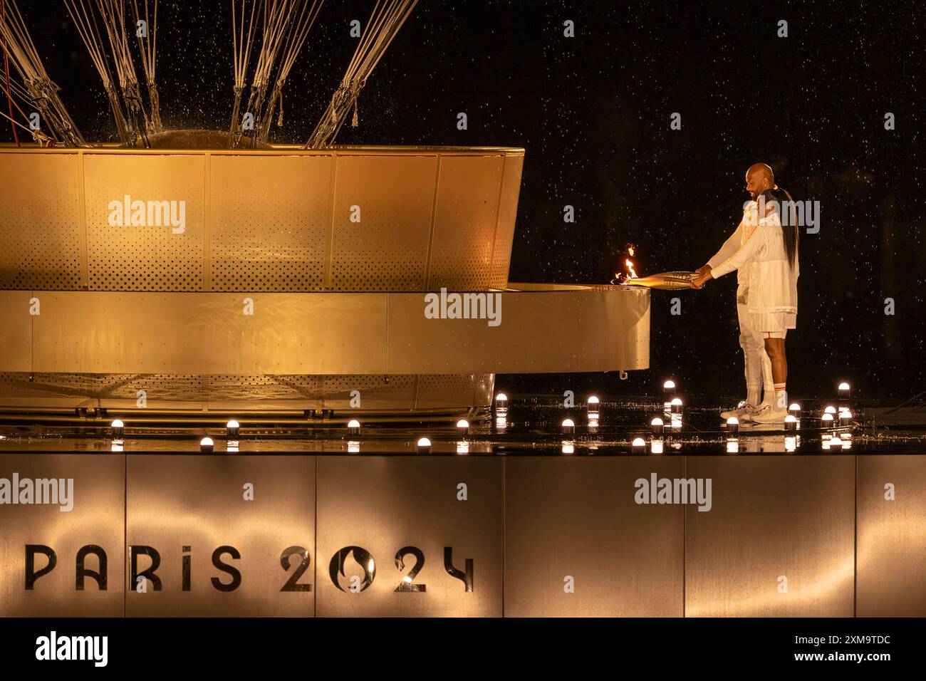 Paris, France. 27th July, 2024. Lighting of the Olympic flame by Teddy ...