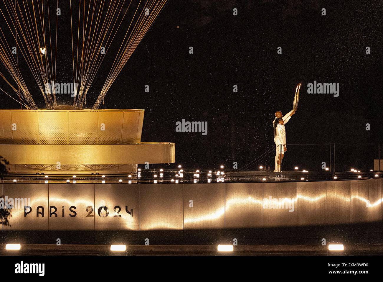 Paris, France. 27th July, 2024. Lighting of the Olympic flame by Teddy ...