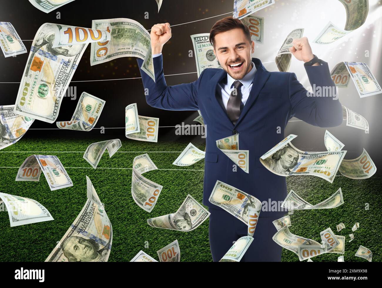 Happy man under money shower at stadium Stock Photo - Alamy