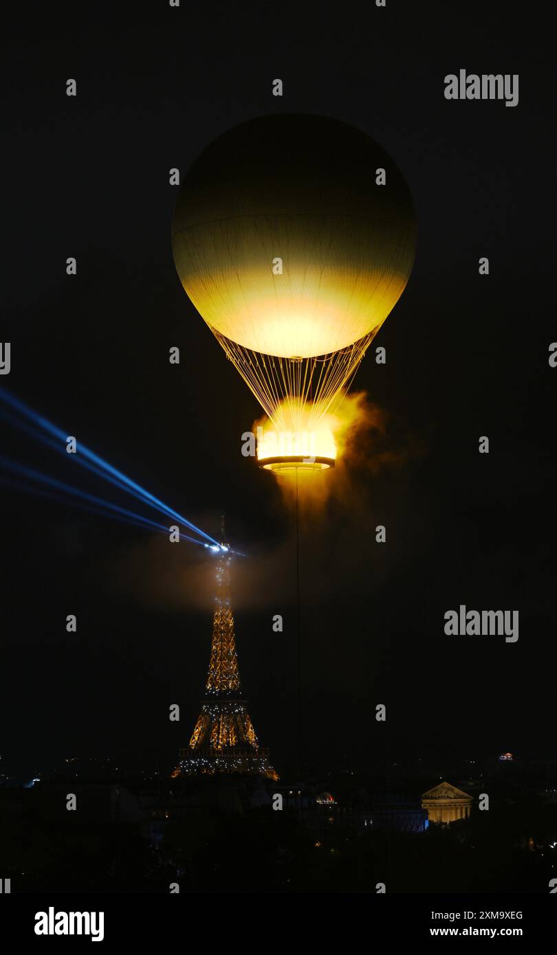 Paris, France. 26th July, 2024. A balloon carrying the lit Olympic ...
