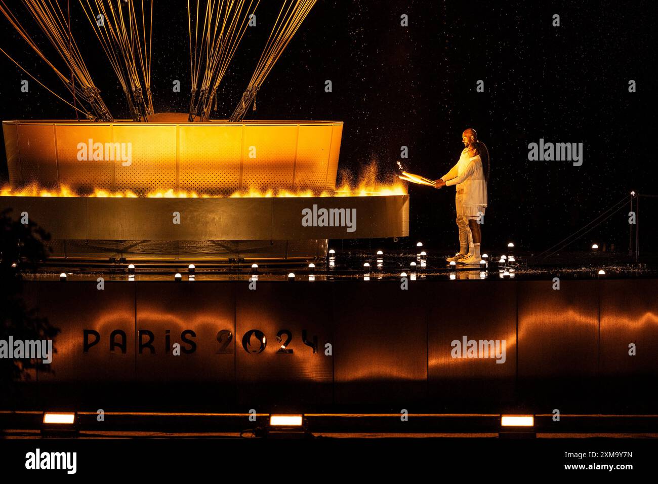 Paris, France. 27th July, 2024. Lighting of the Olympic flame by Teddy ...