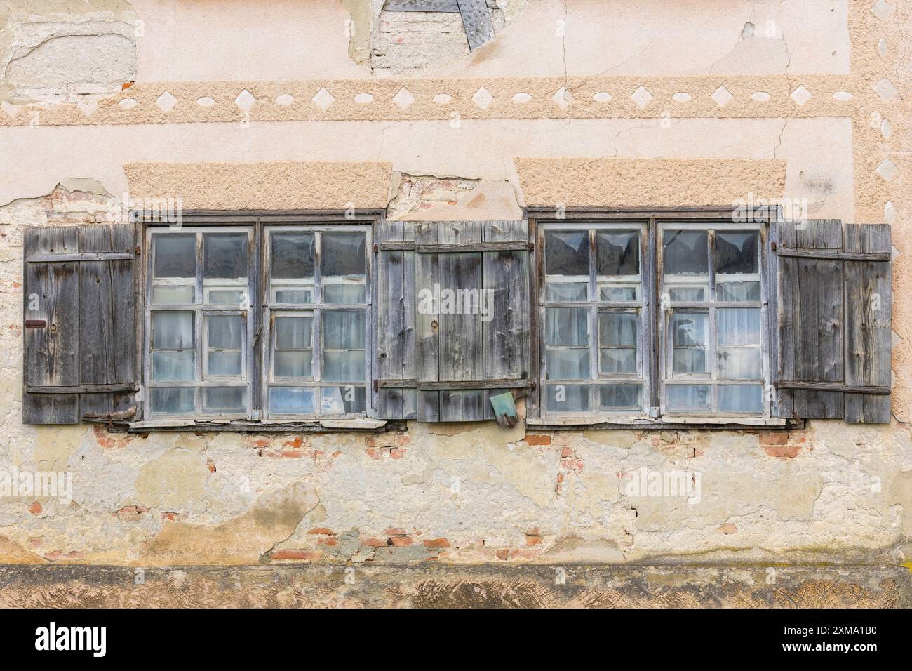 Old historic half-timbered house, windows, shutters, facade, in need of ...