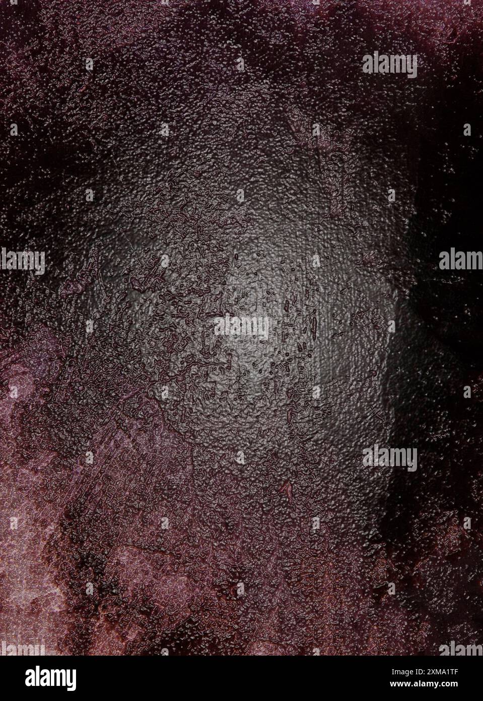 Dark abstract textured background blending maroon, purple, and black ...