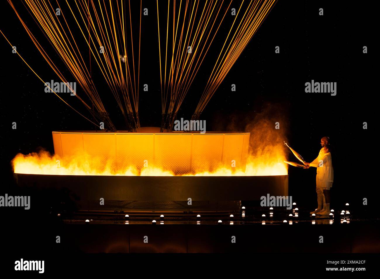 Paris, France. 27th July, 2024. Lighting of the Olympic flame by Teddy ...