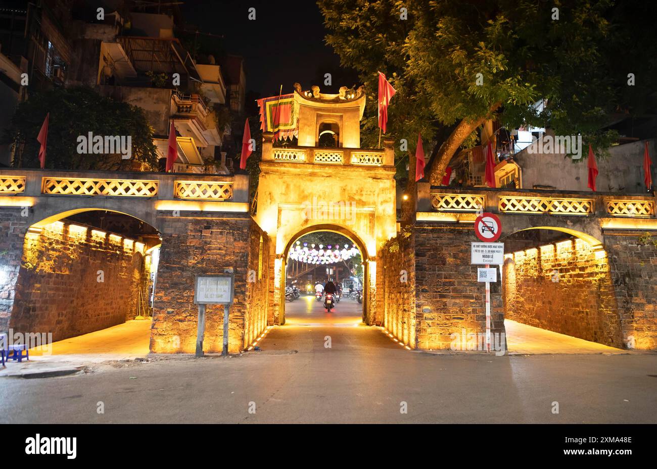 Illuminated old town gate at night, Hanoi, Vietnam Stock Photo - Alamy