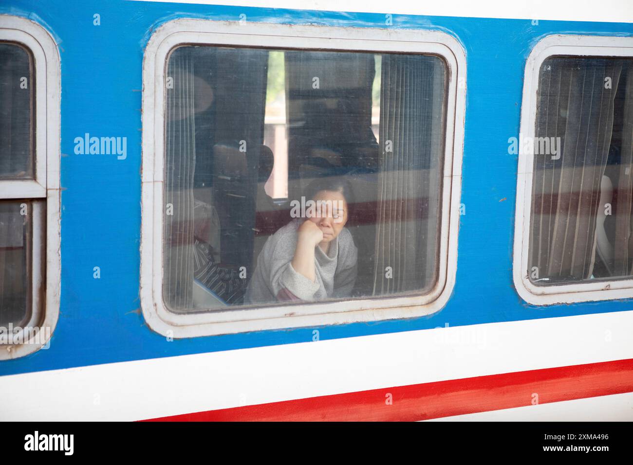 Vietnamese woman looking out of a train window, Hanoi, Vietnam Stock ...