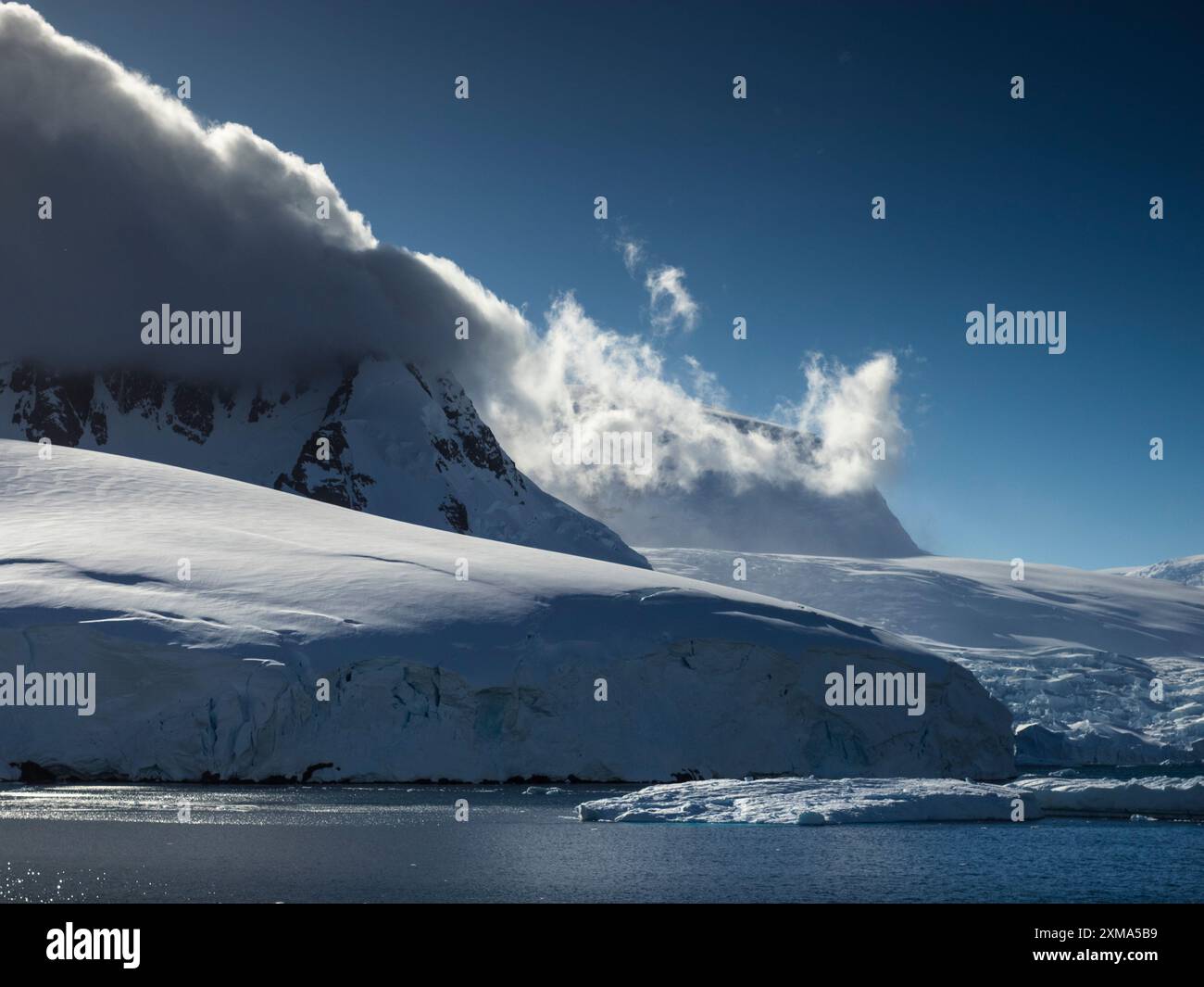 Low clouds obscure Graham Land at the northern entrance to the Lemaire ...