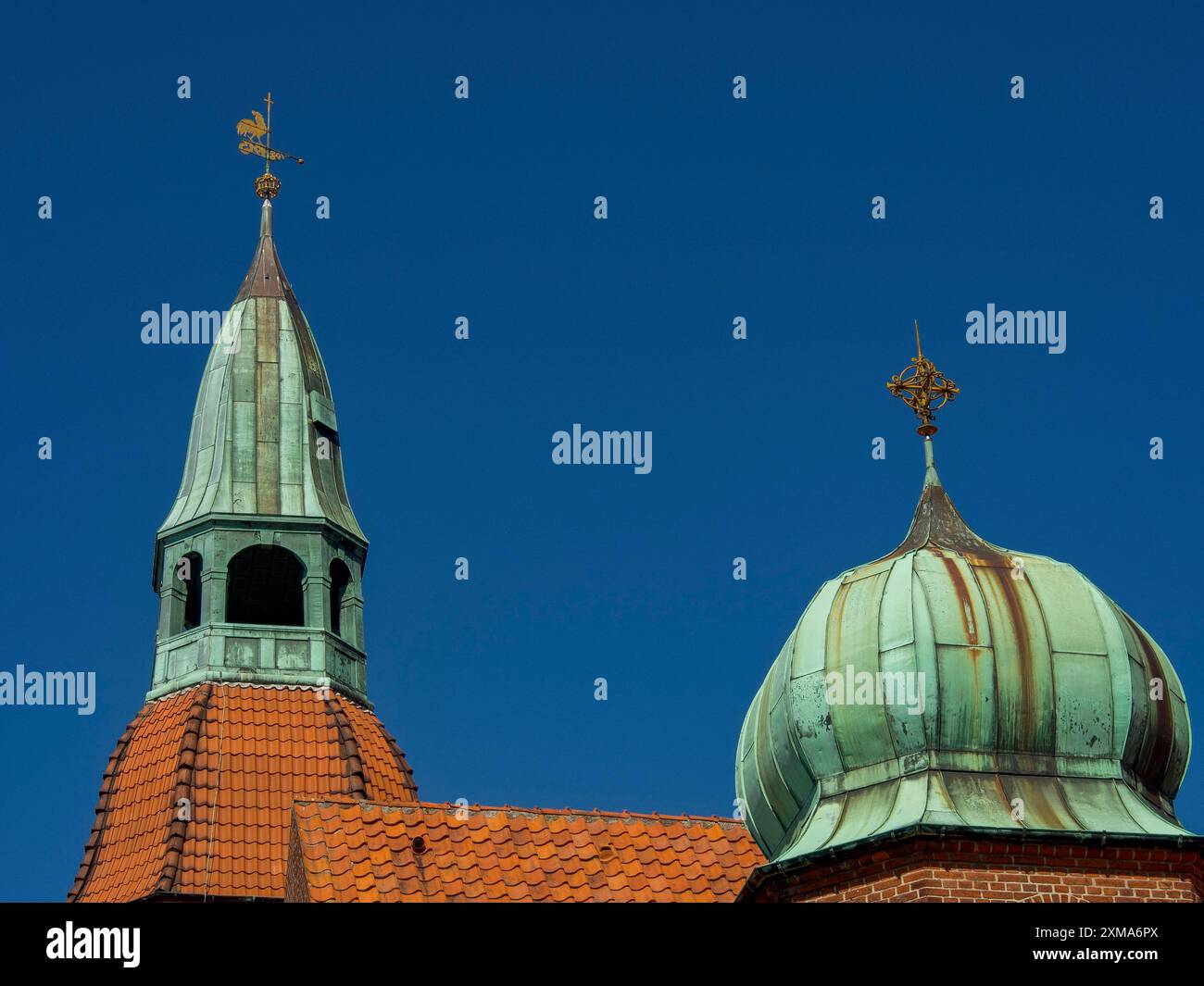Two tower-like structures with domed roofs on a historic building under ...