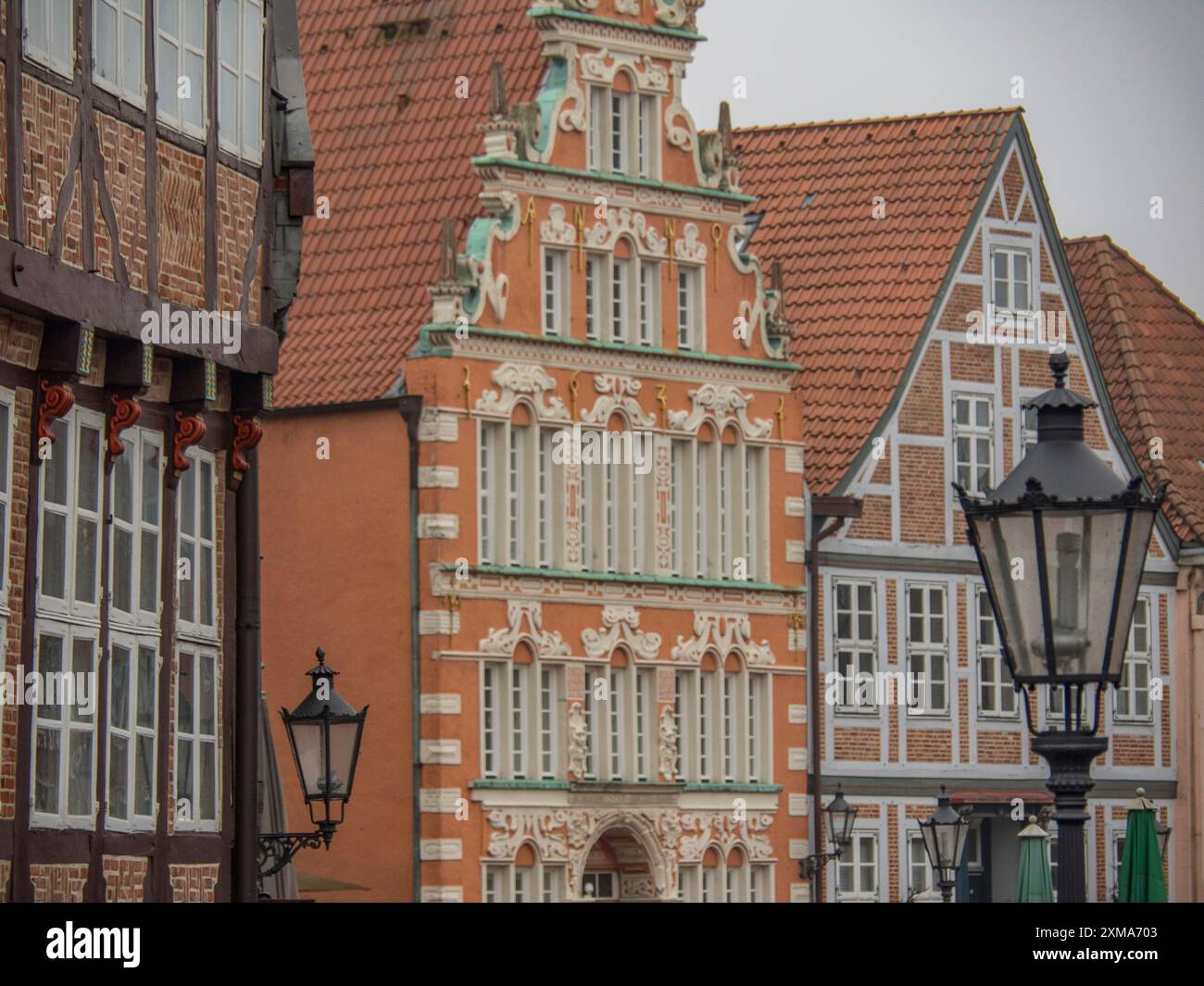 Historic buildings with ornate facades and lanterns in the old town ...