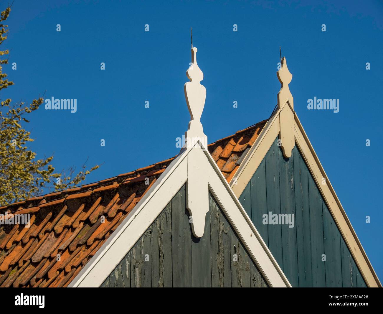 Close-up of traditional house roofs with wooden cladding and orange ...