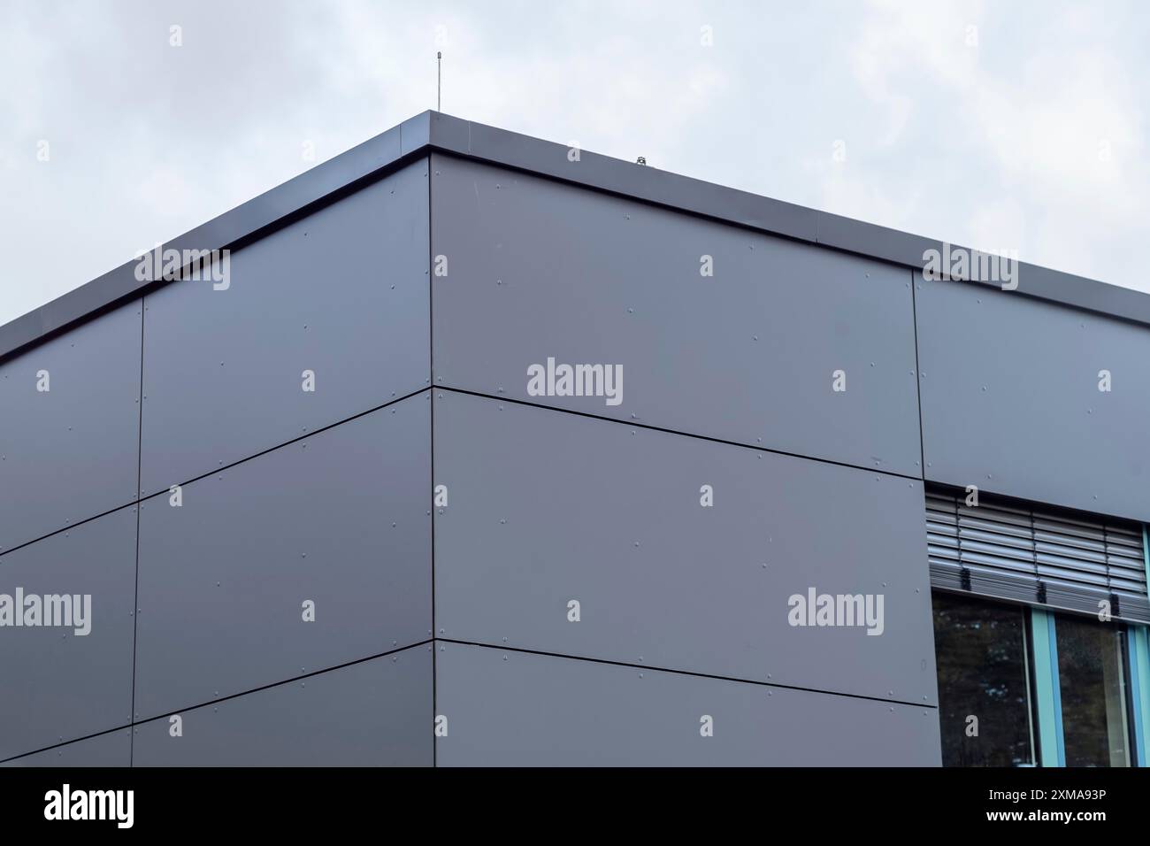Minimalist view of a grey building wall with clear lines and shapes ...