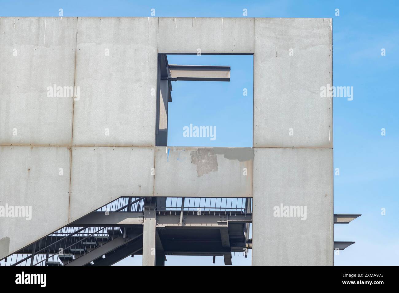 Modern concrete architecture with sky cut-out and geometric shapes ...