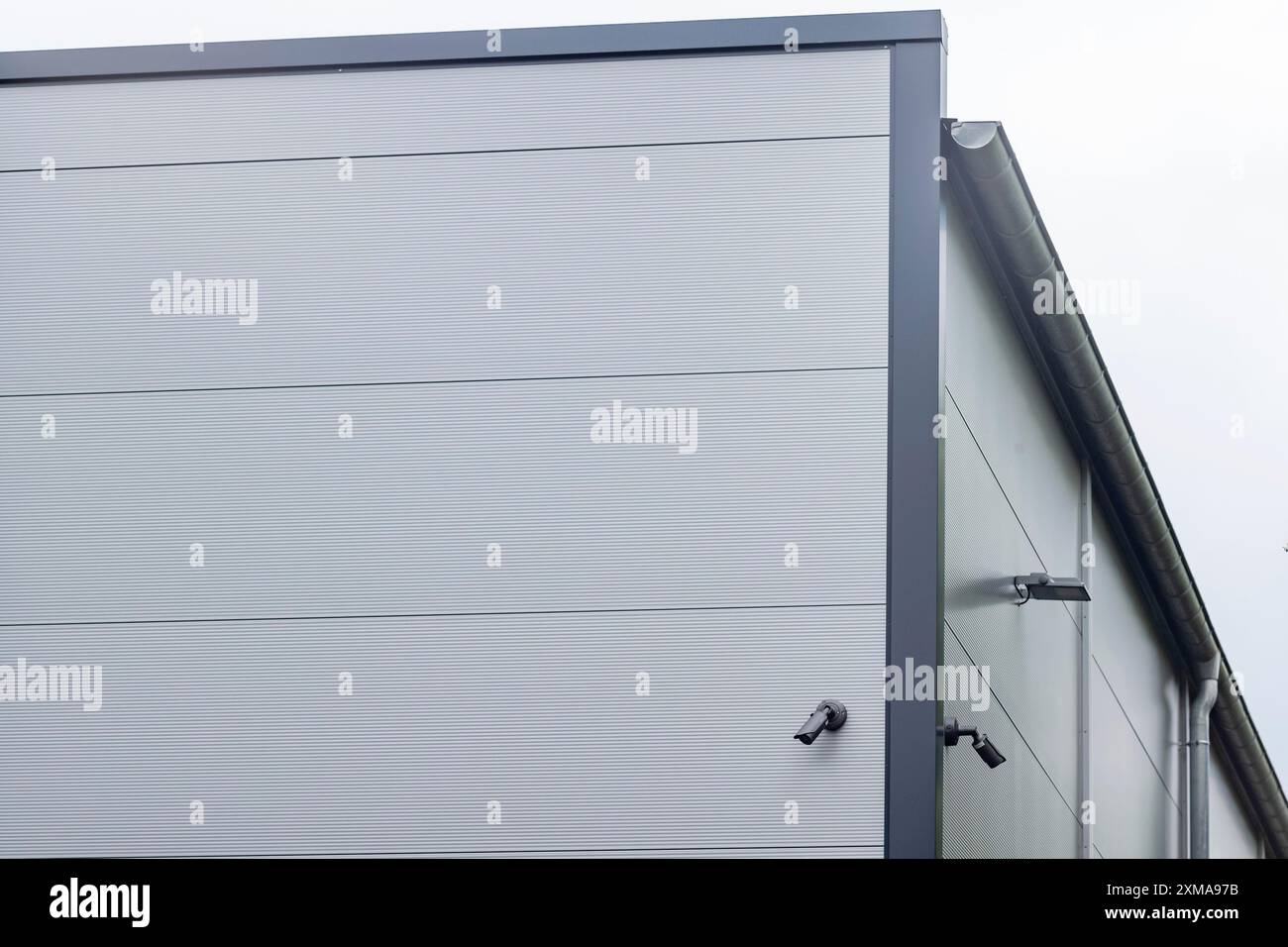 Corner of an industrial building with a minimalist grey facade Stock ...