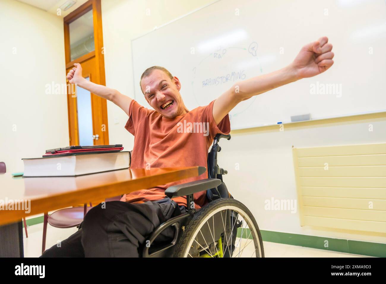 Man with disability proud of himself in the university celebrating ...