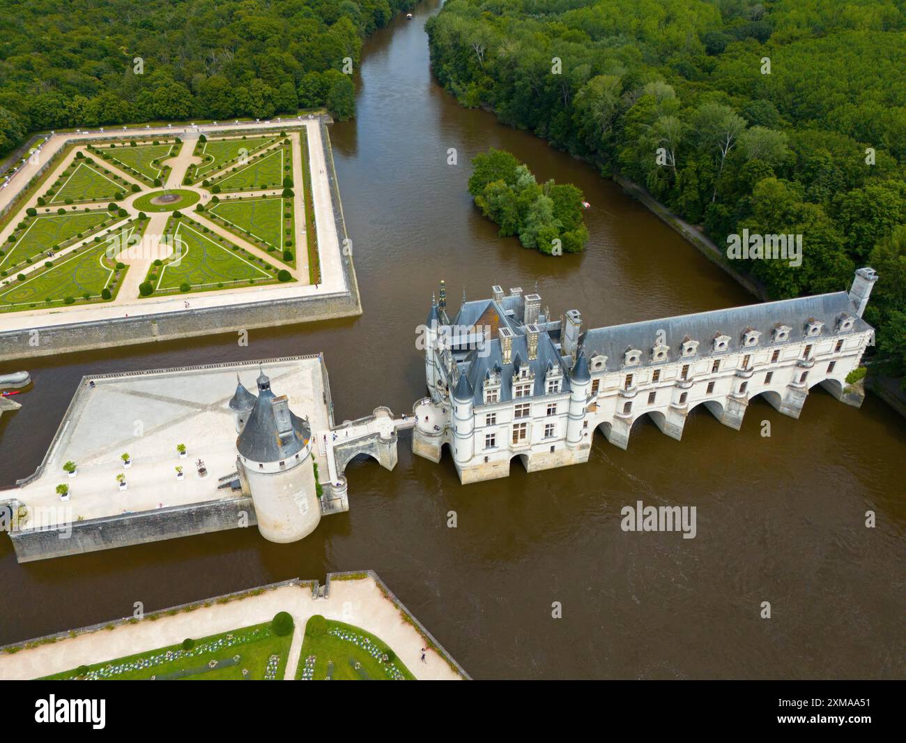 Historic castle with a Renaissance garden by a river and surrounded by ...