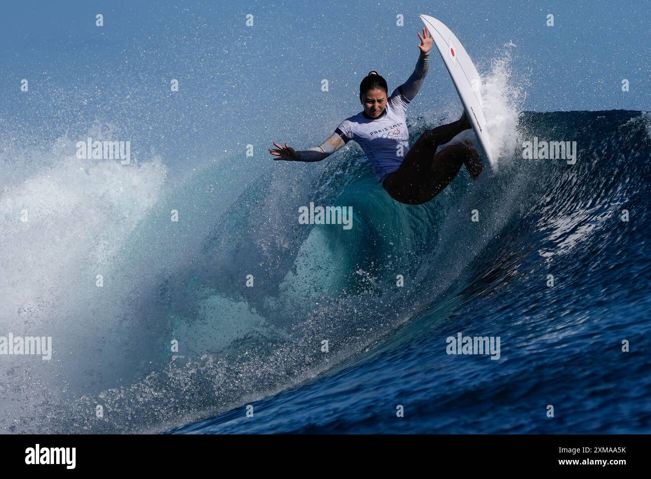 Shino Matsuda, of Japan, surfs during a training session ahead of the ...