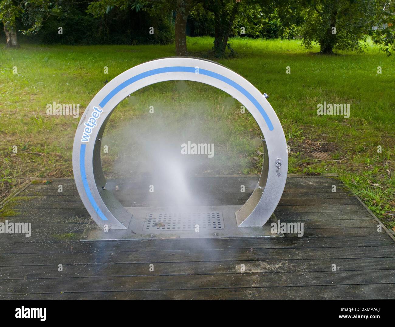 Circular water feature in a park that generates water mist and provides ...