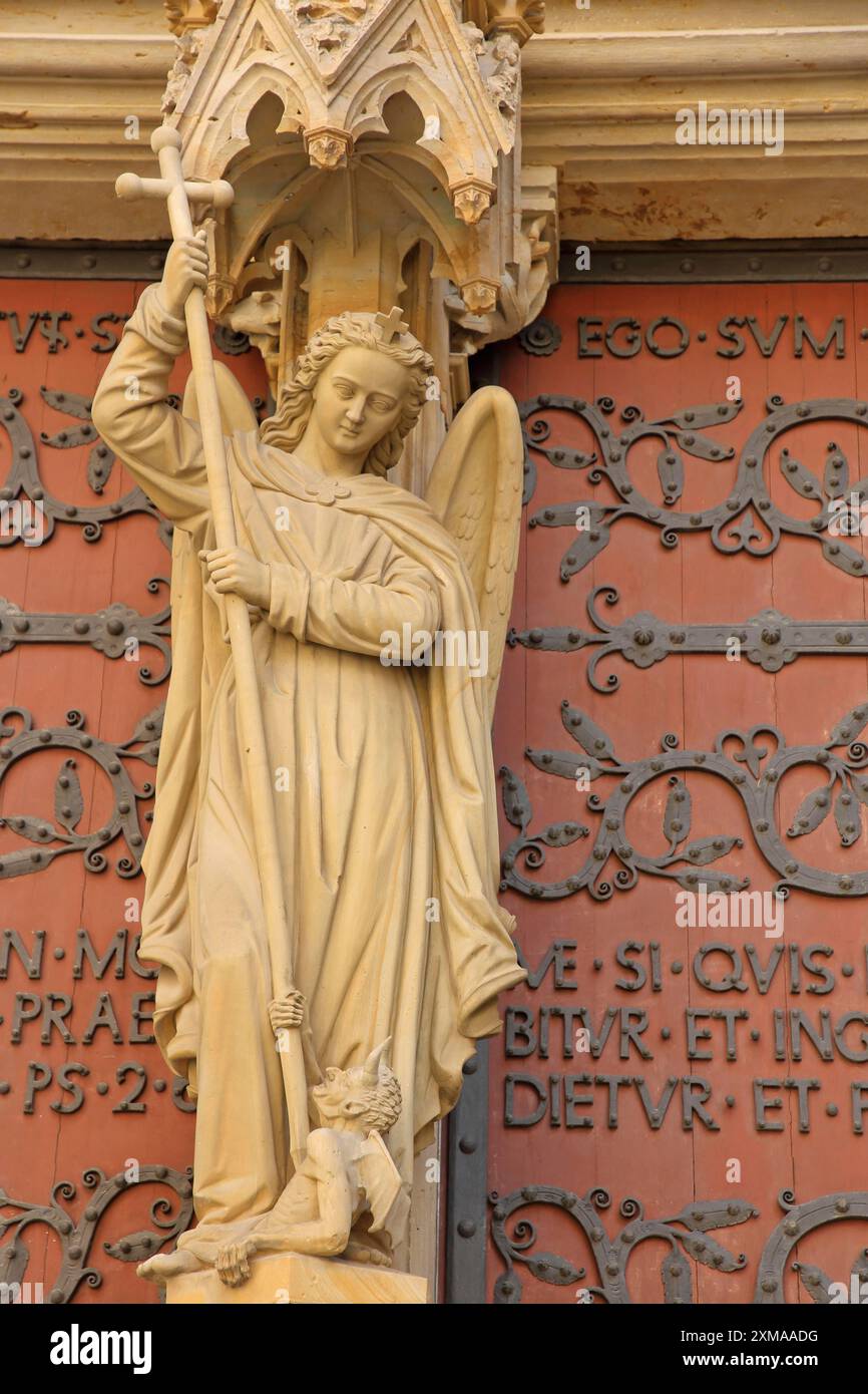 Sculpture of the Archangel Michael with lance and cross at the portal ...