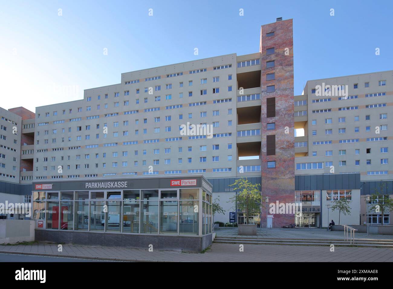 Modern red high-rise building with inner courtyard, inscription, multi ...