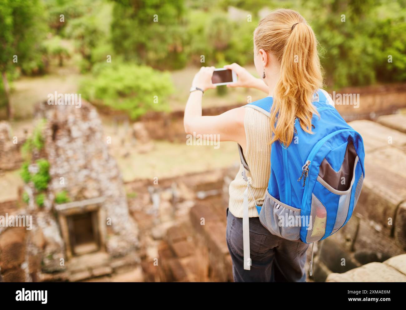 Tourist taking picture from top of Pre Rup, Angkor, Cambodia Stock ...