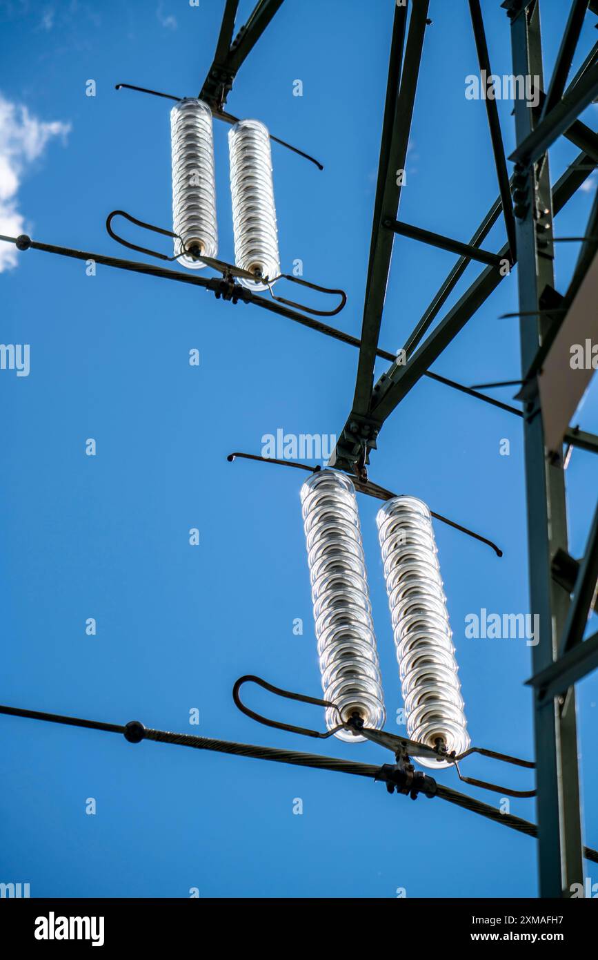 Insulators made of glass on a high-voltage line, they hang on the ...