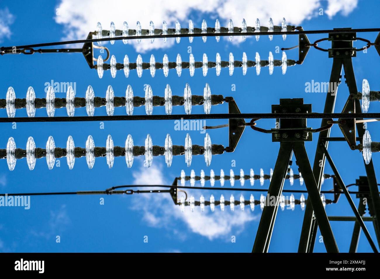 Insulators made of glass on a high-voltage line, they hang on the ...