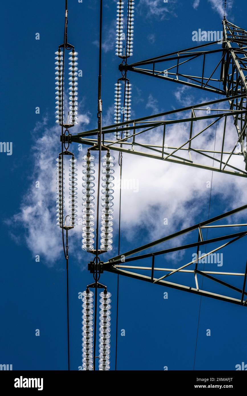 Insulators made of glass on a high-voltage line, they hang on the ...
