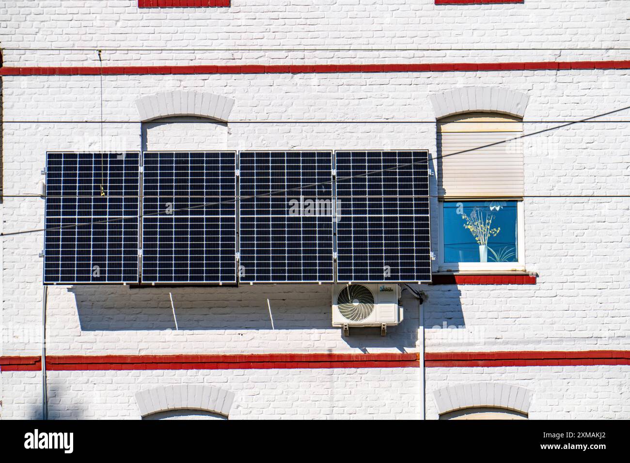 Solar system on the exterior wall of a residential building Stock Photo ...