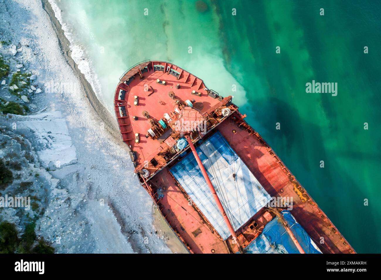 Aerial top down view of a bow part of an abandoned bulk-carrier dry ...
