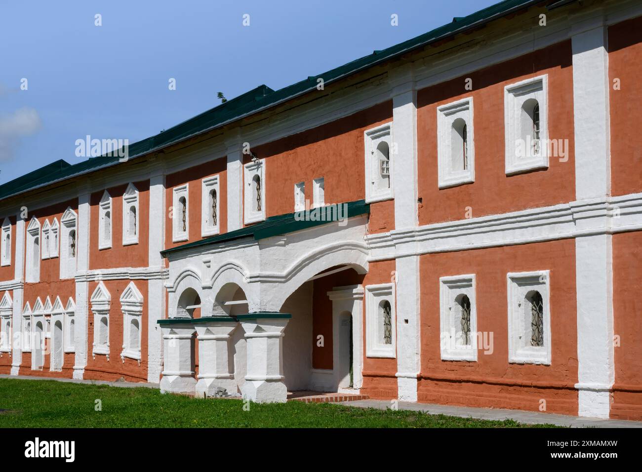 Brick porch with columns and archs of the medieval building of the ...
