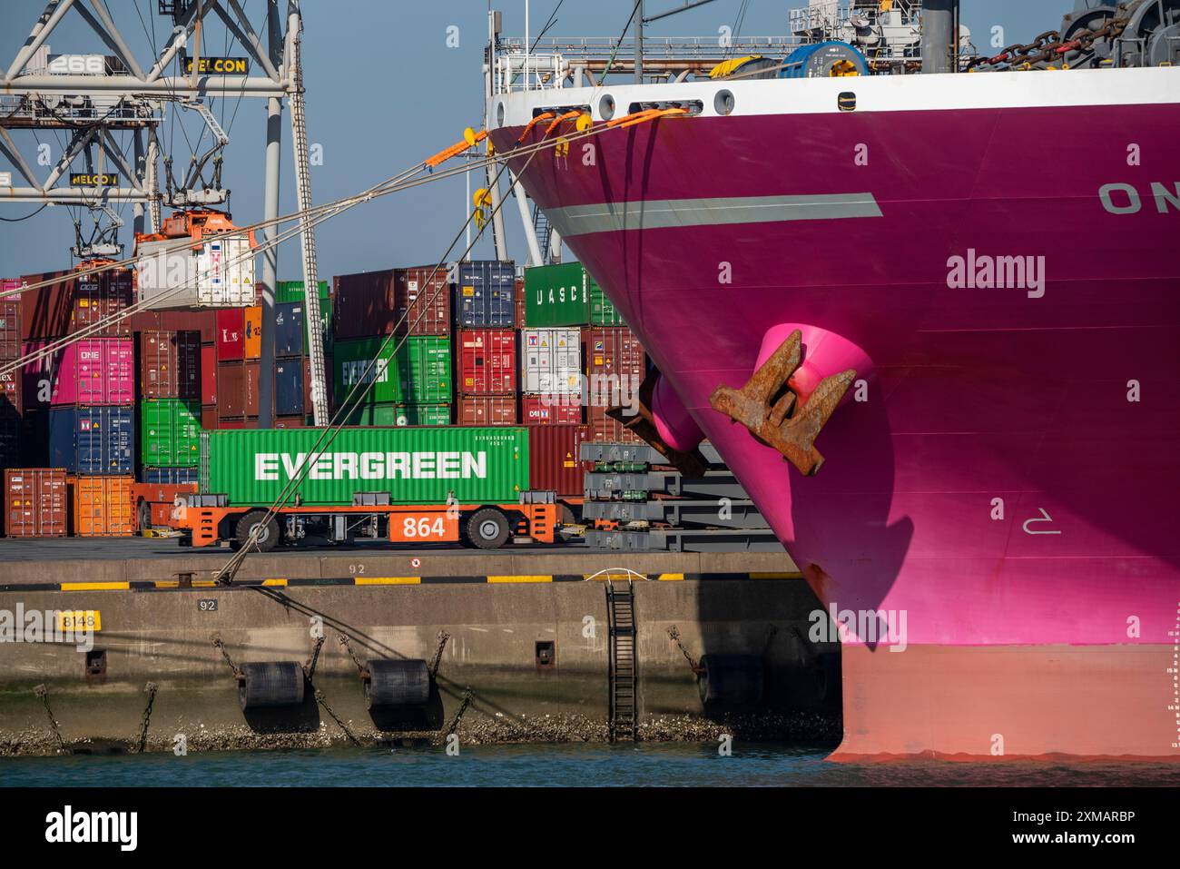 Self-driving, automated container transporters bring the containers to ...