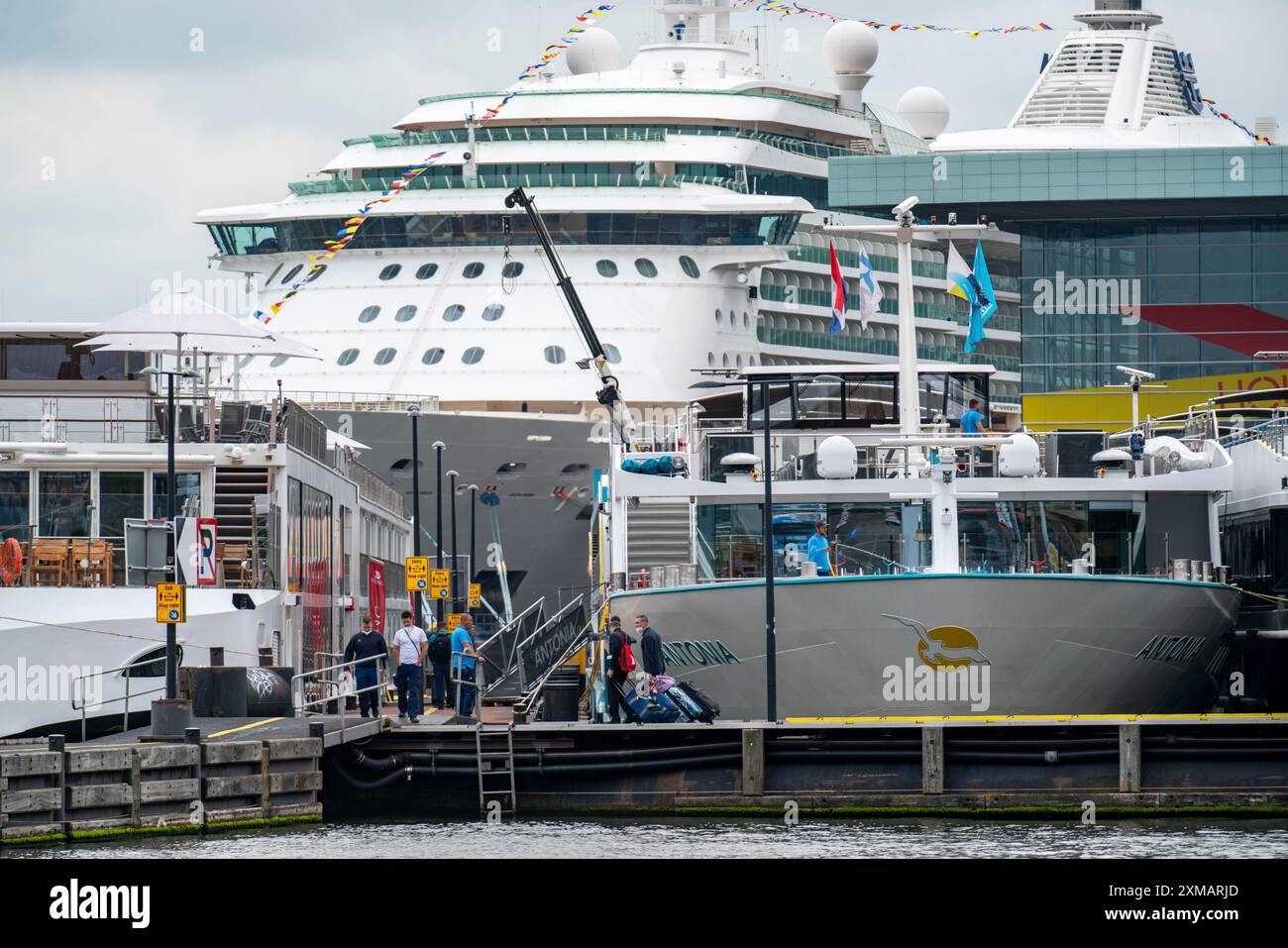 River cruise ships at the quay of the Ij, near the main railway station ...