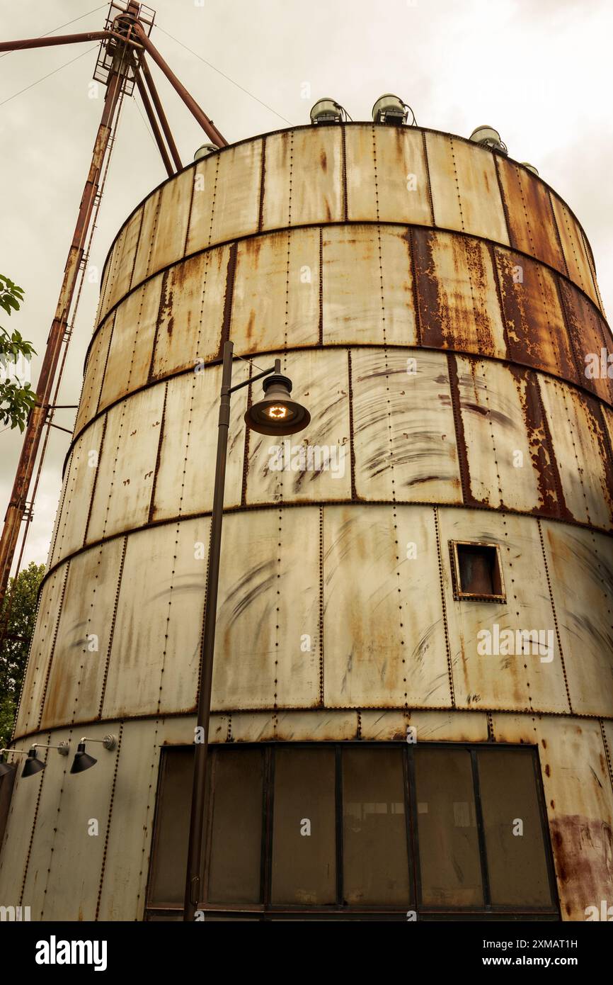 Historic mill and grain silo in Buda, Texas. A cylindrical silo with a ...