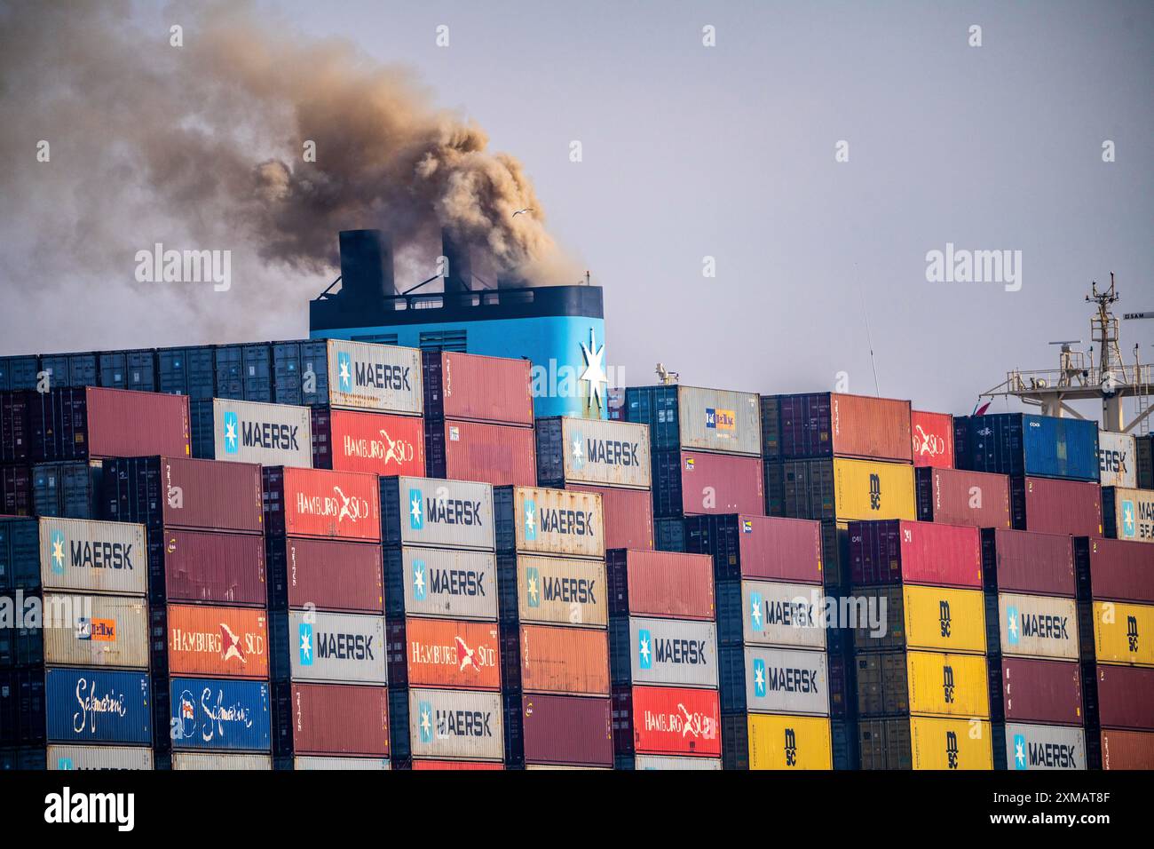 Container freighter Madison Maersk smoking chimneys of the ship's ...