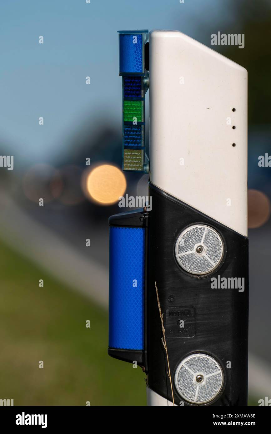 Delineator posts on a country road, with additional blue reflectors to ...