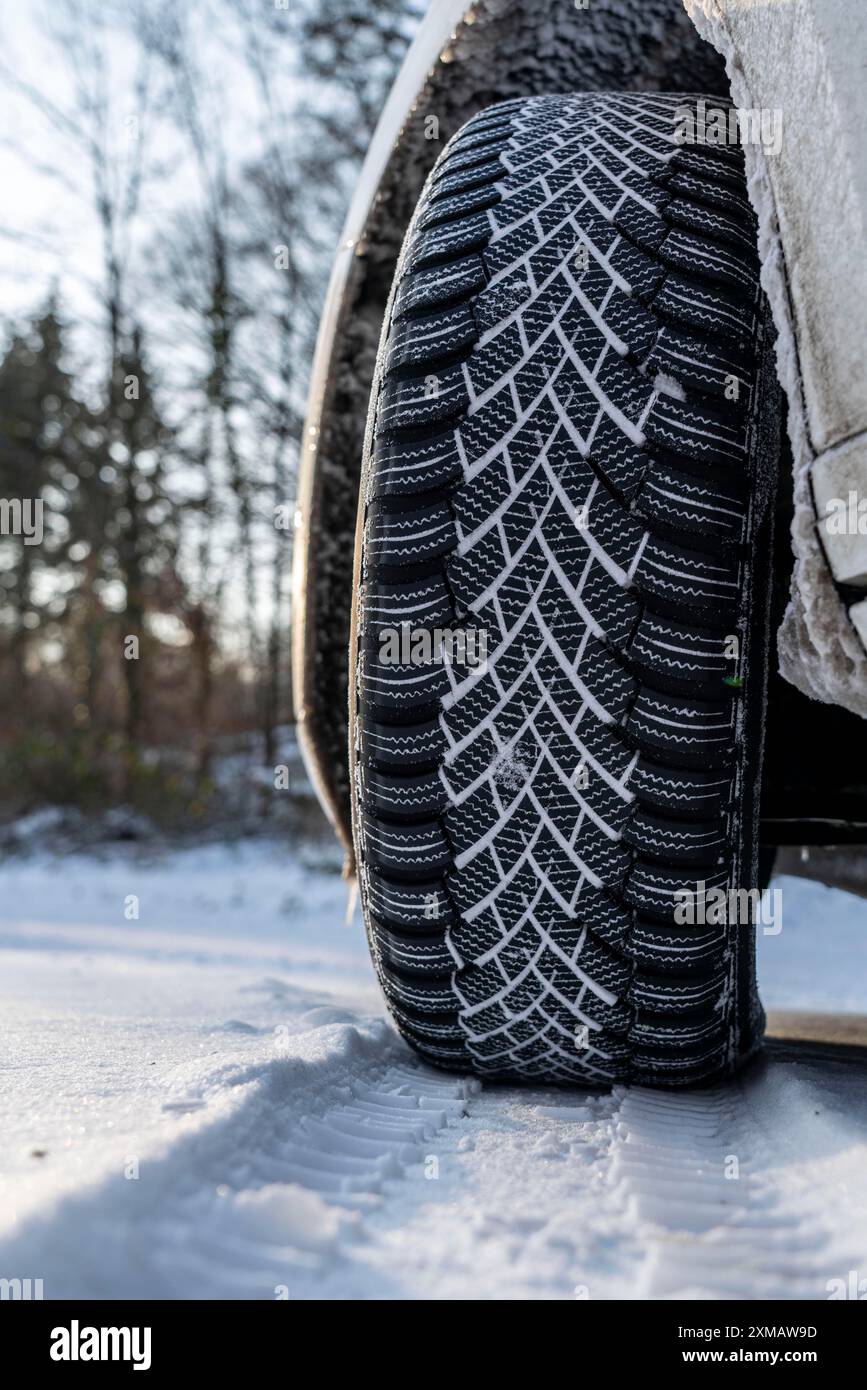 Winter tyres, driving on a road with snow cover, grip on the snow ...
