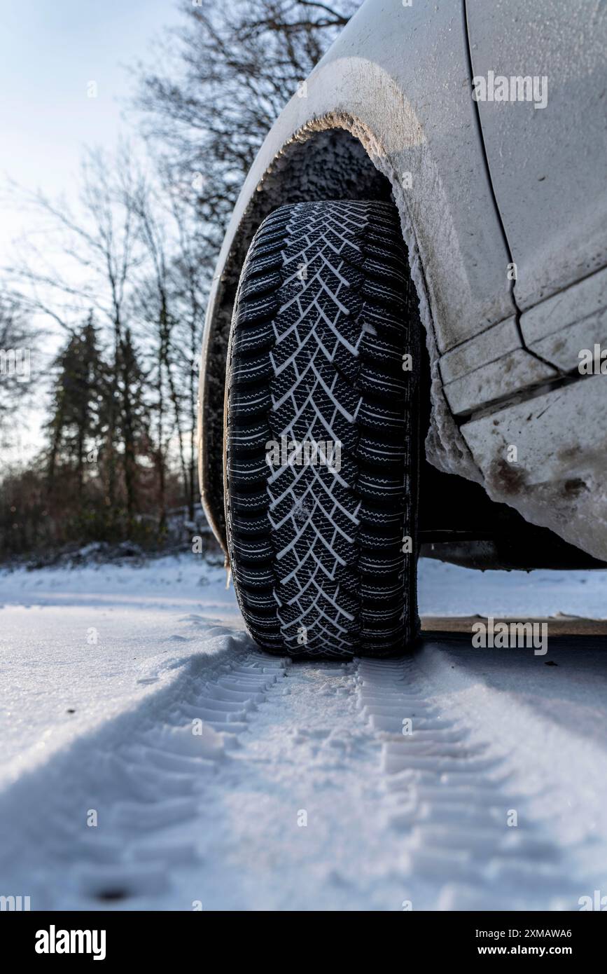 Winter tyres, driving on a road with snow cover, grip on the snow ...