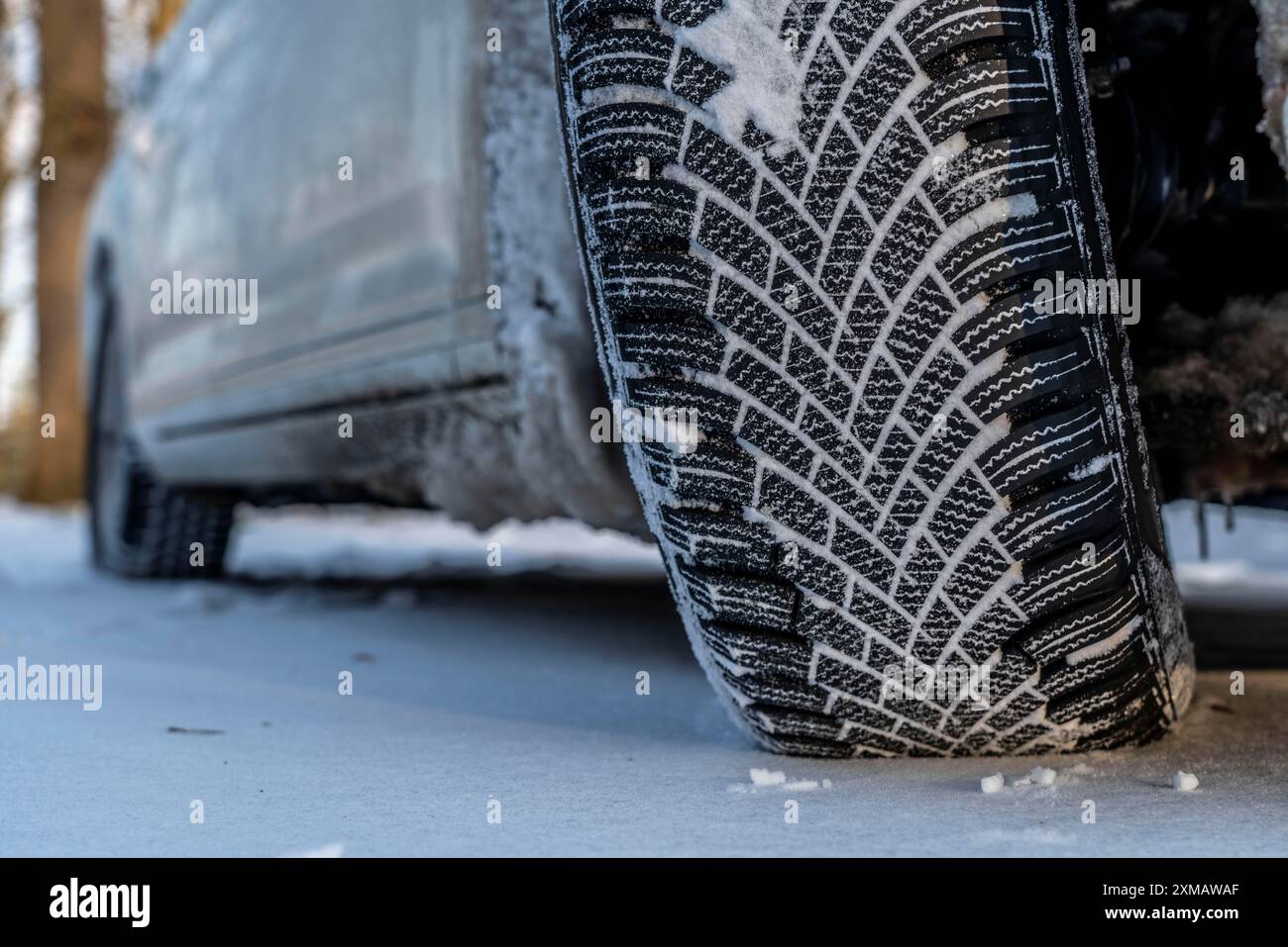 Winter tyres, driving on a road with snow cover, grip on the snow ...