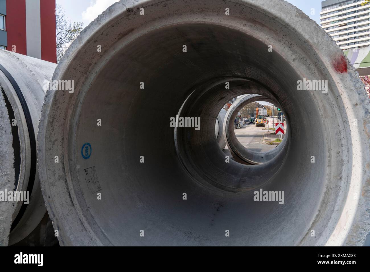 Concrete sewer pipes, stored on a construction site during sewer ...