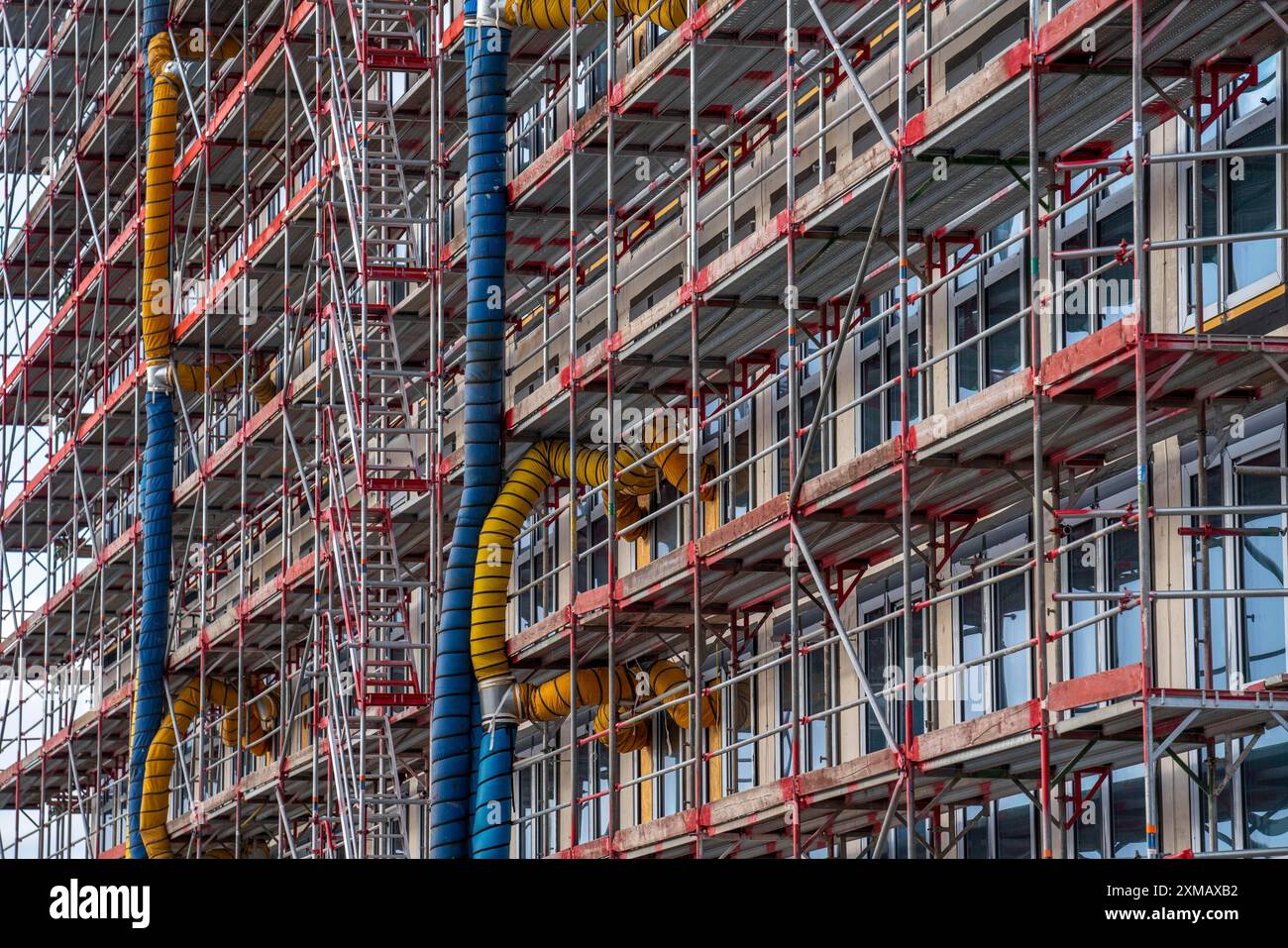 Large construction site, scaffolded shell of an office building complex ...