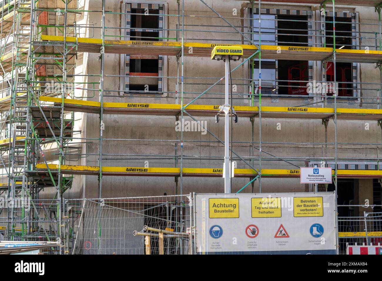 Large construction site, scaffolded shell of an office and commercial ...