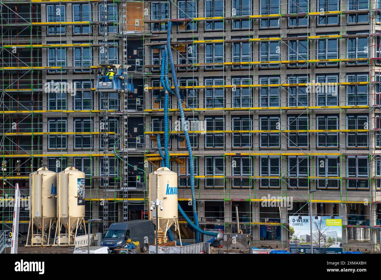 Large construction site, scaffolded shell of an office building complex ...