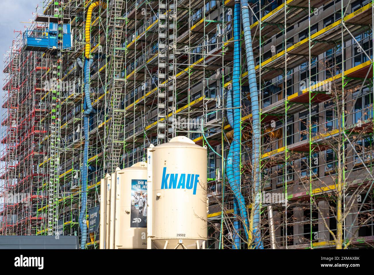 Large construction site, scaffolded shell of an office building complex ...