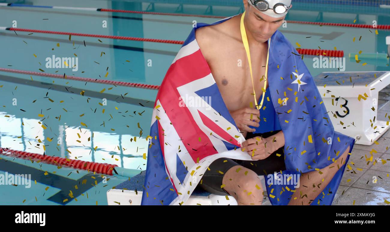 Image of confetti over biracial male swimmer with medal holding flag of ...
