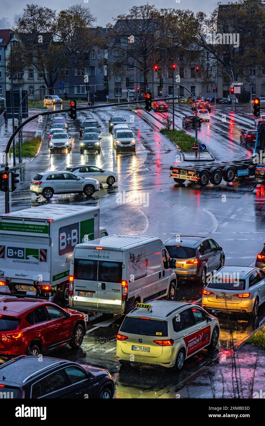 Rainy weather, road traffic, intersection, lights of vehicles on a wet ...